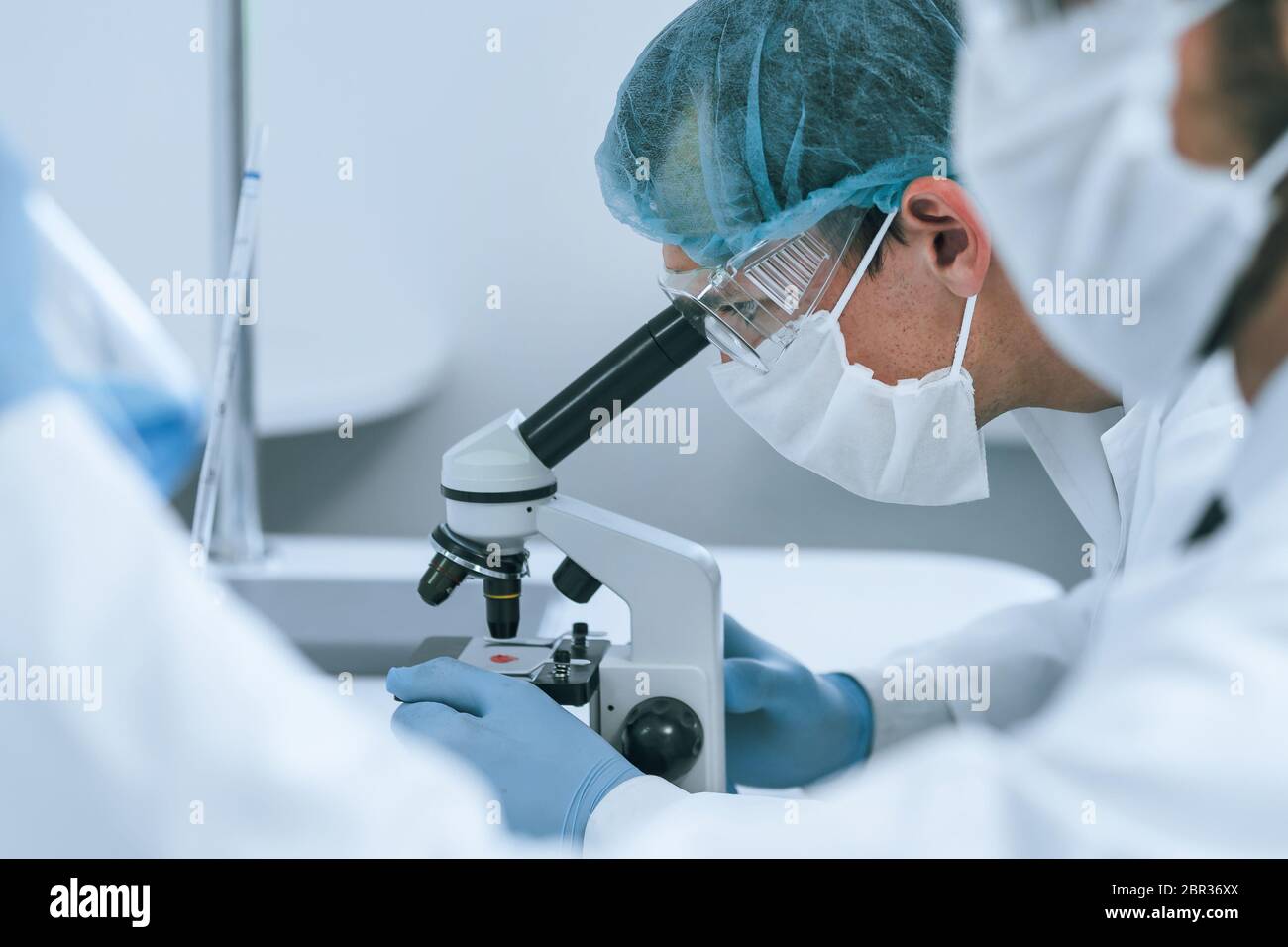 close up. group of scientists conducts testing in the laboratory Stock ...