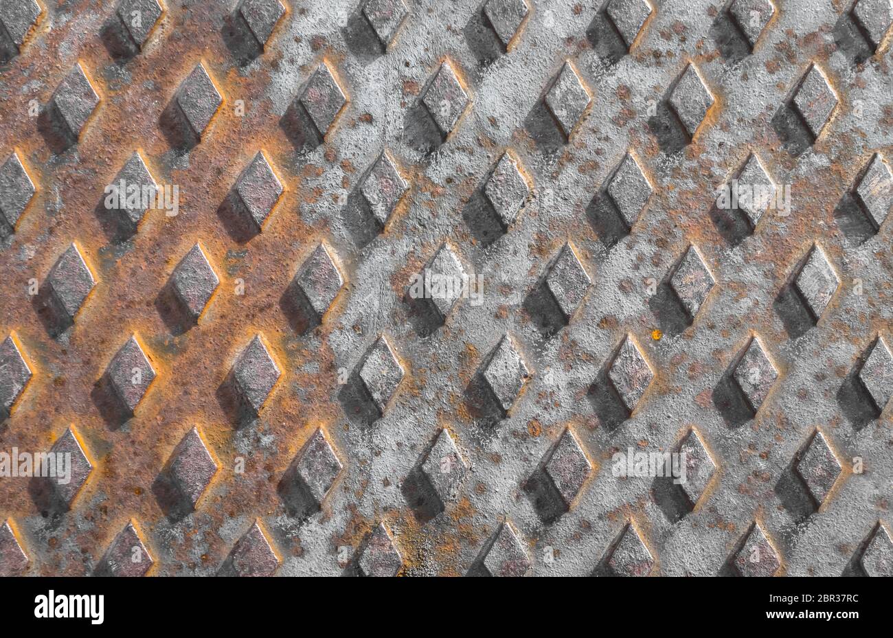 Old rusty drain cover background with diamond pattern Stock Photo - Alamy