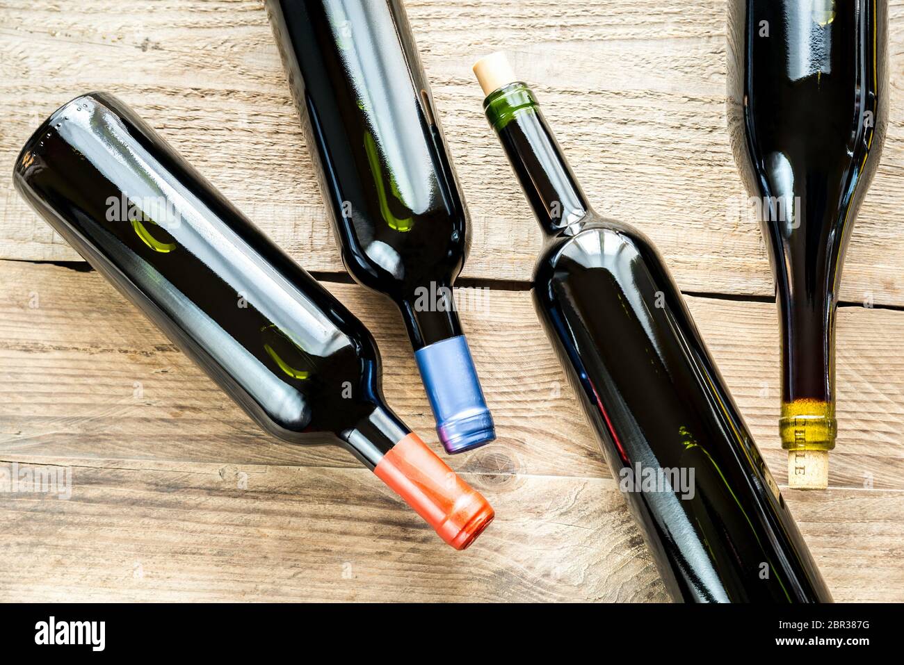 Bottles with red wine Stock Photo - Alamy