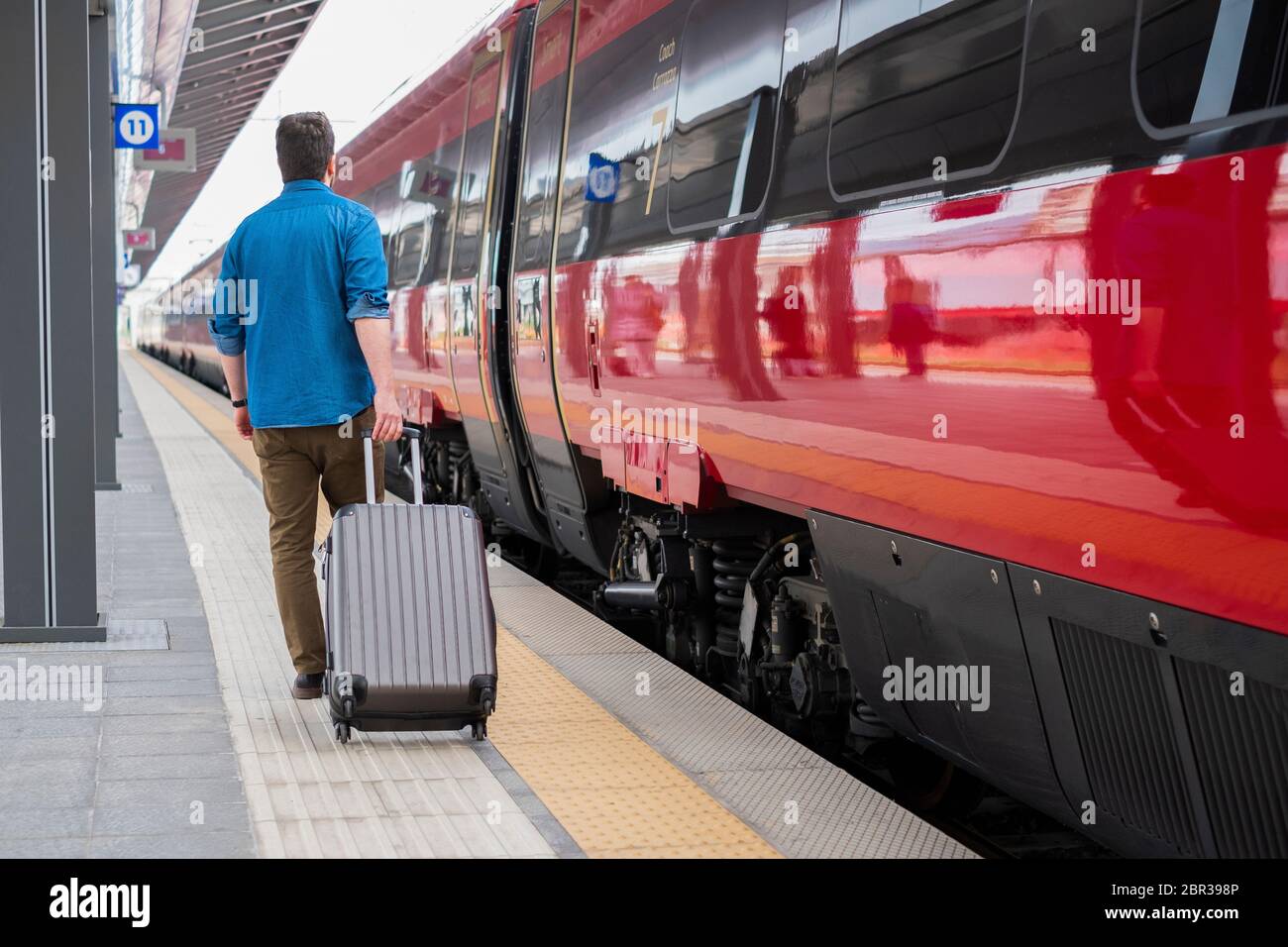 Commuter train leaving station hi-res stock photography and images - Alamy