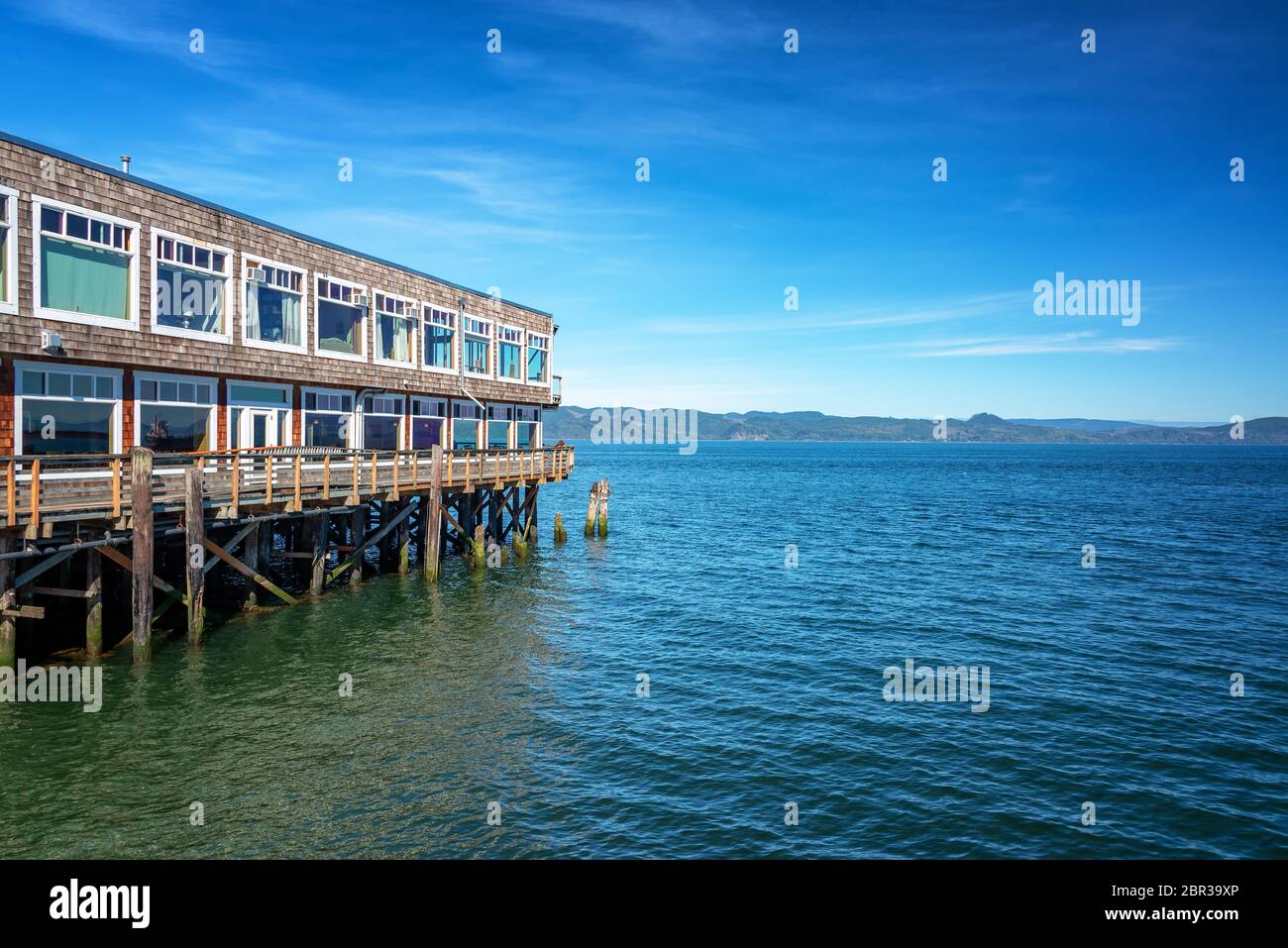 View of a building on an old pier on the Columbia River in Astoria ...