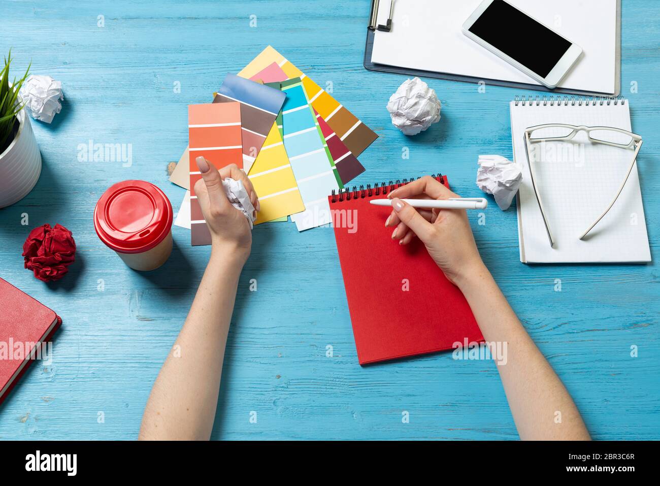 Interior designer choosing colors from swatches Stock Photo - Alamy