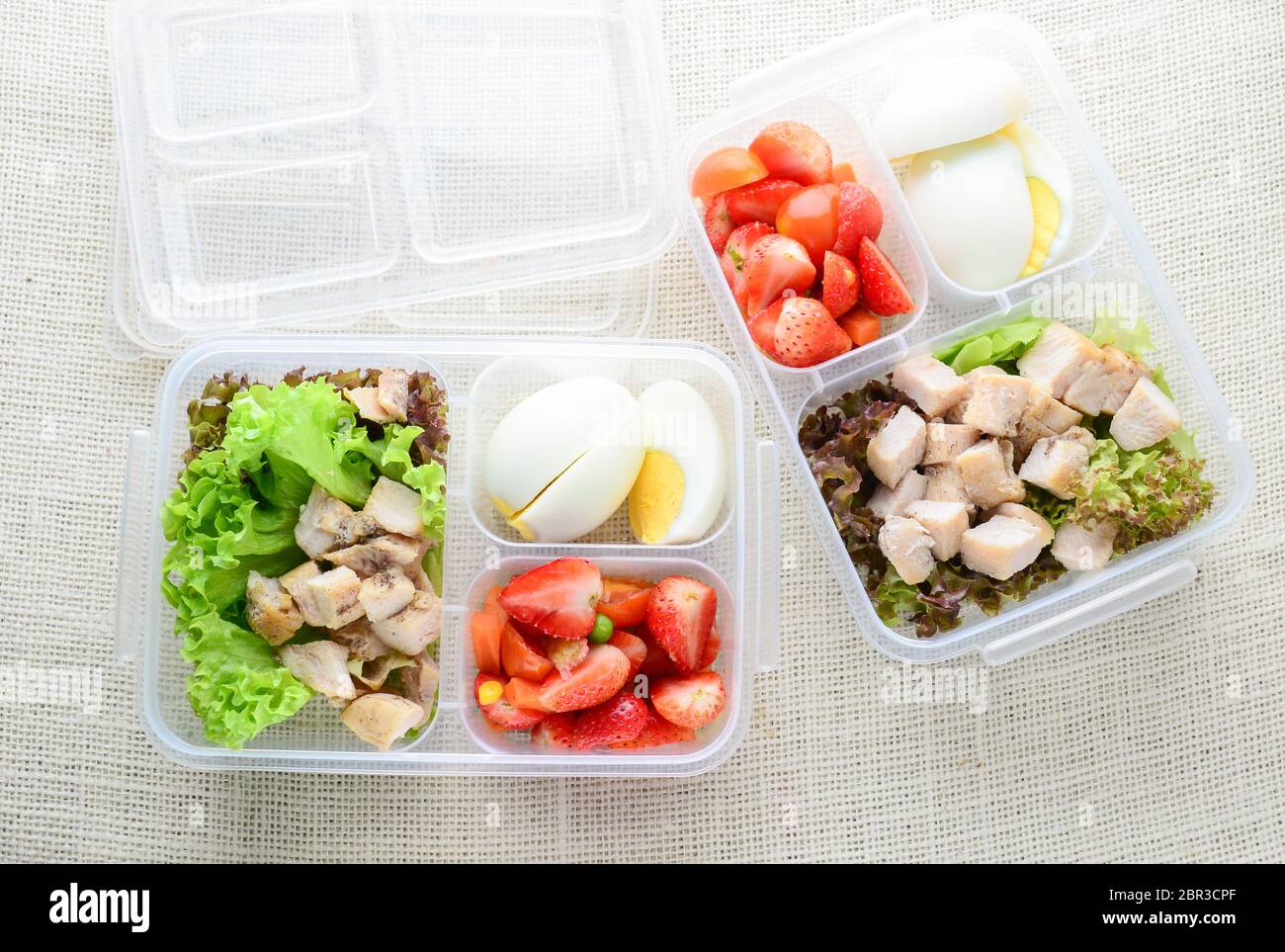 Modern style clean food, boiled egg, grilled chicken and avocado ...