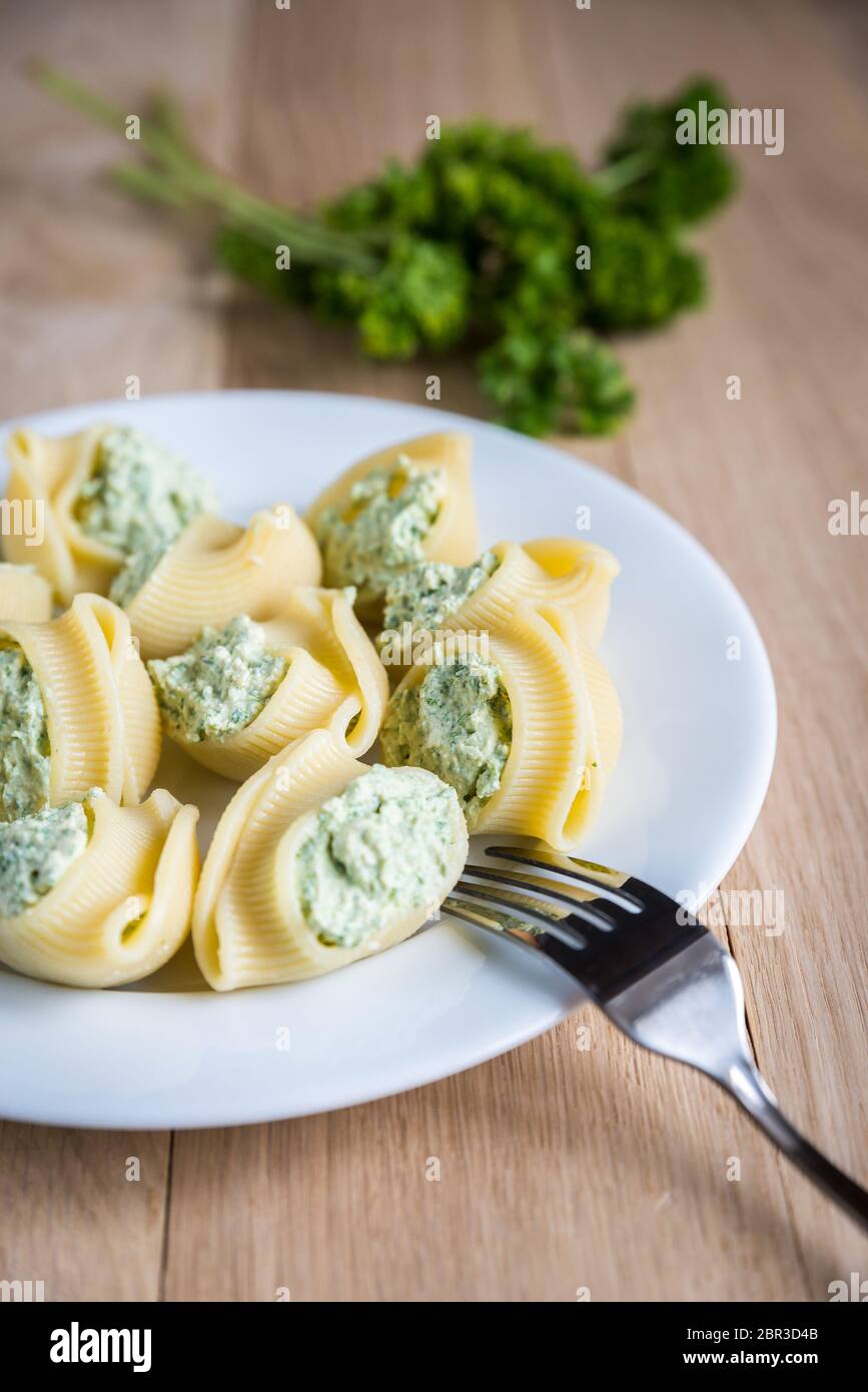 Stuffed lumaconi with cheese Stock Photo - Alamy