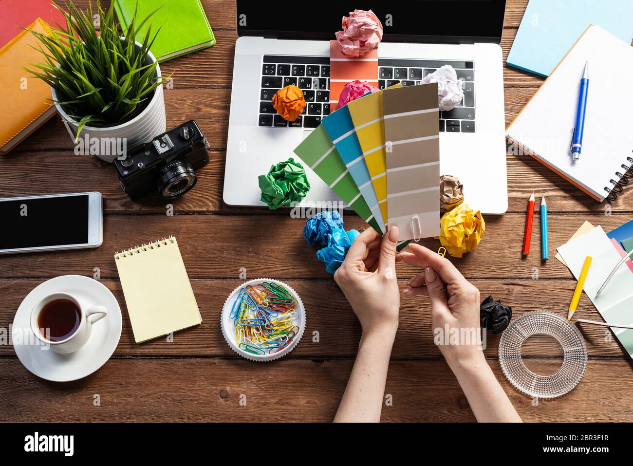 Interior designer choosing colors from swatches Stock Photo - Alamy