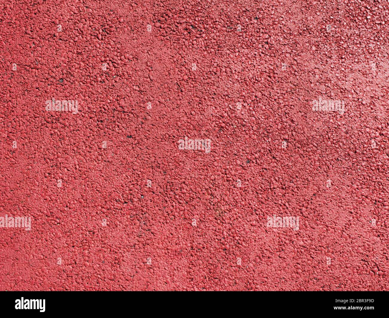 red tarmac texture useful as a background Stock Photo - Alamy