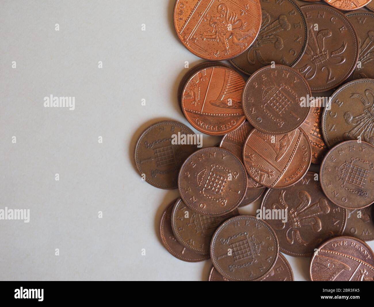 One Penny and Two Pence Pound coins money (GBP), currency of United ...