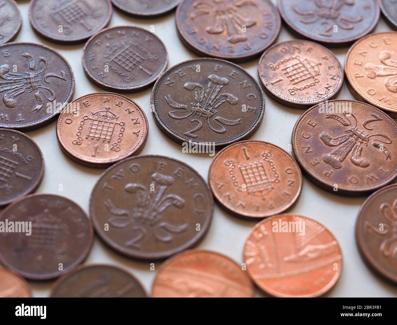 One Penny and Two Pence Pound coins money (GBP), currency of United ...