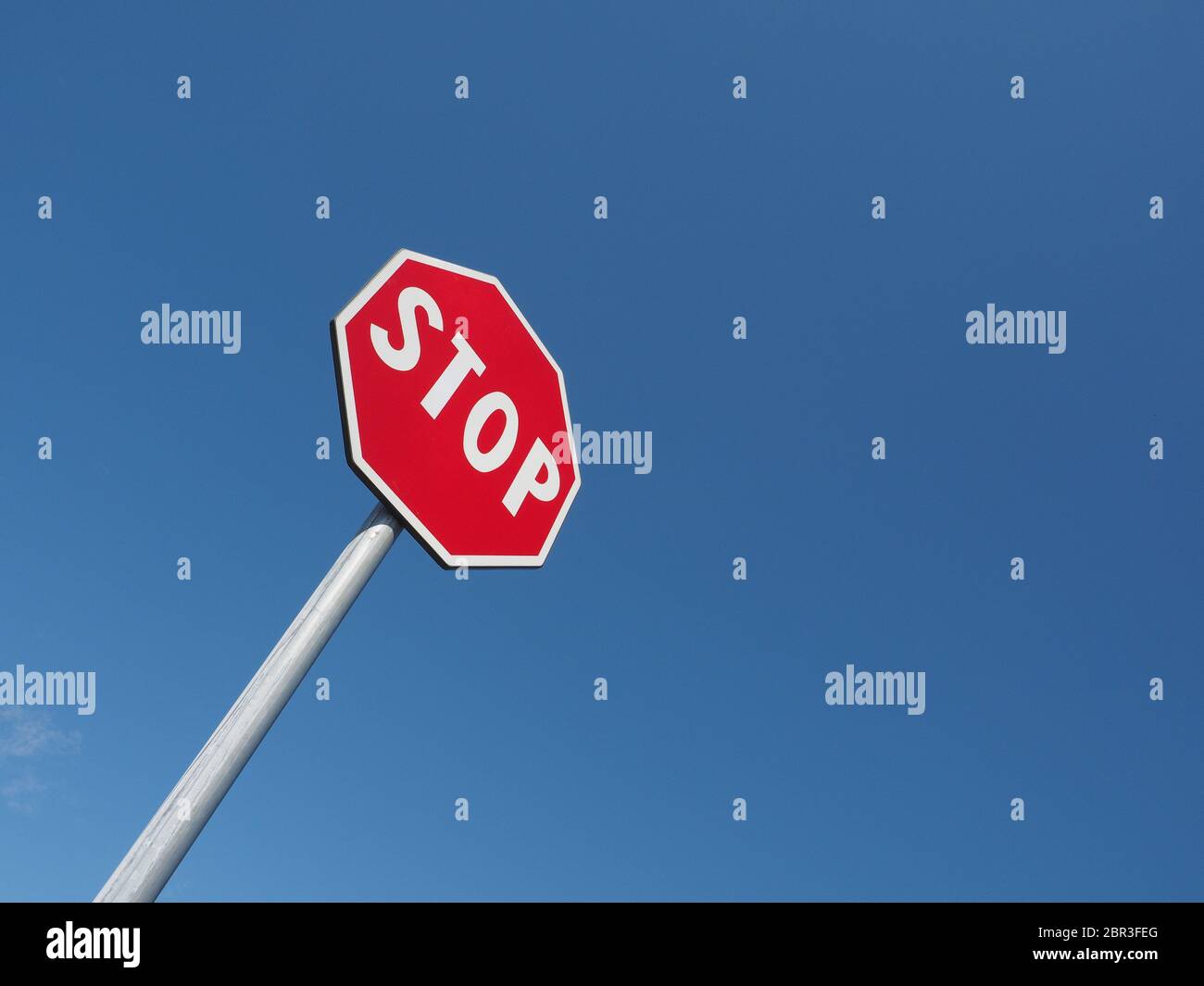 Warning signs, stop traffic sign over blue sky Stock Photo - Alamy
