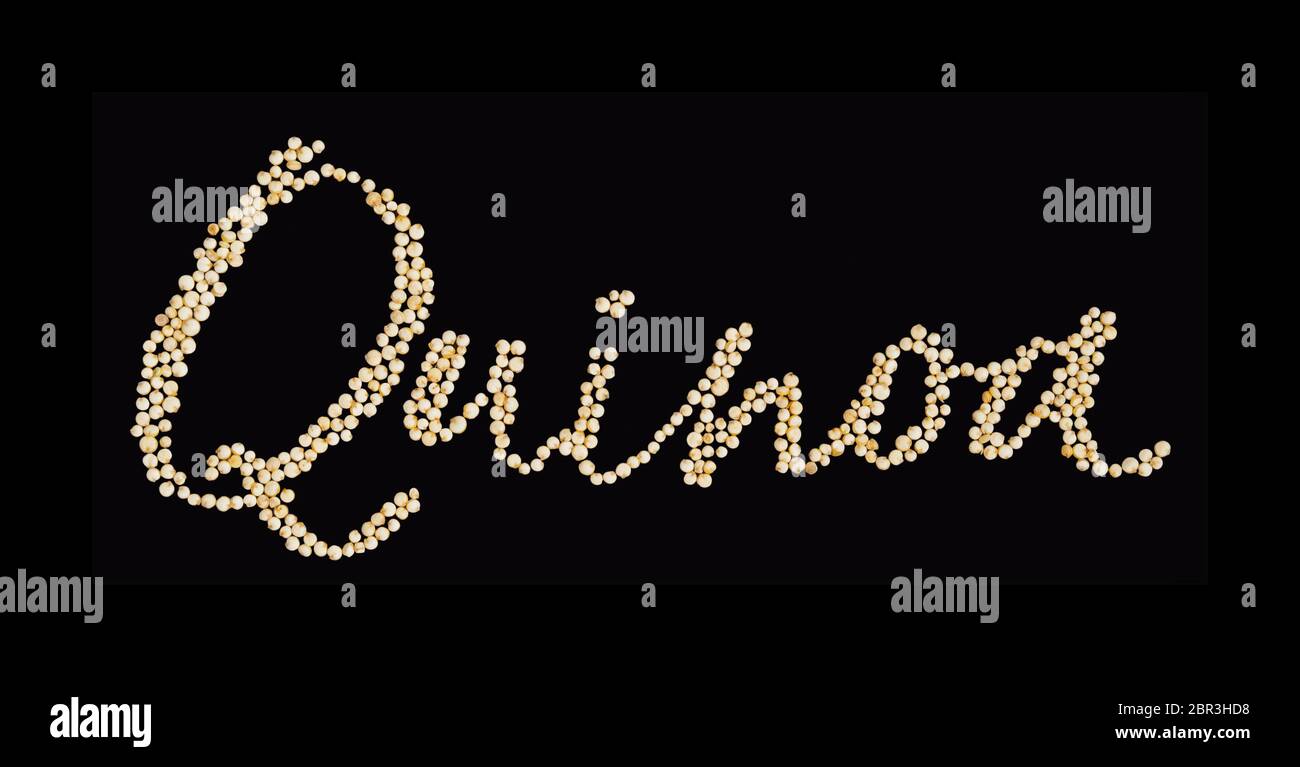 Word Quinoa made from raw grains, isolated on black background with ...