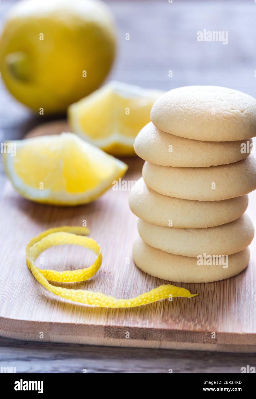 Biscuits filled with lemon cream on the wooden board Stock Photo - Alamy