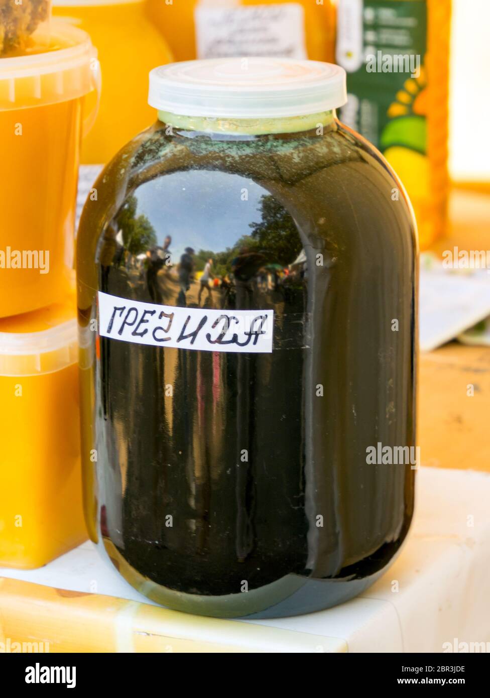 Three-liter glass jar with buckwheat honey Stock Photo - Alamy