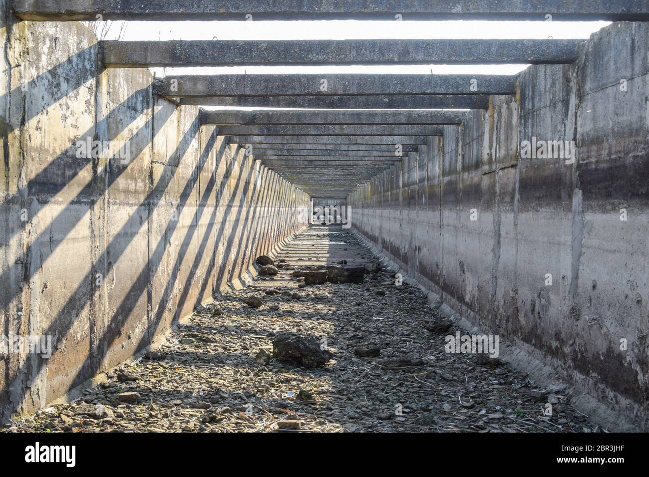 Canal irrigation system rice fields. Concrete tunnel for the irrigation ...