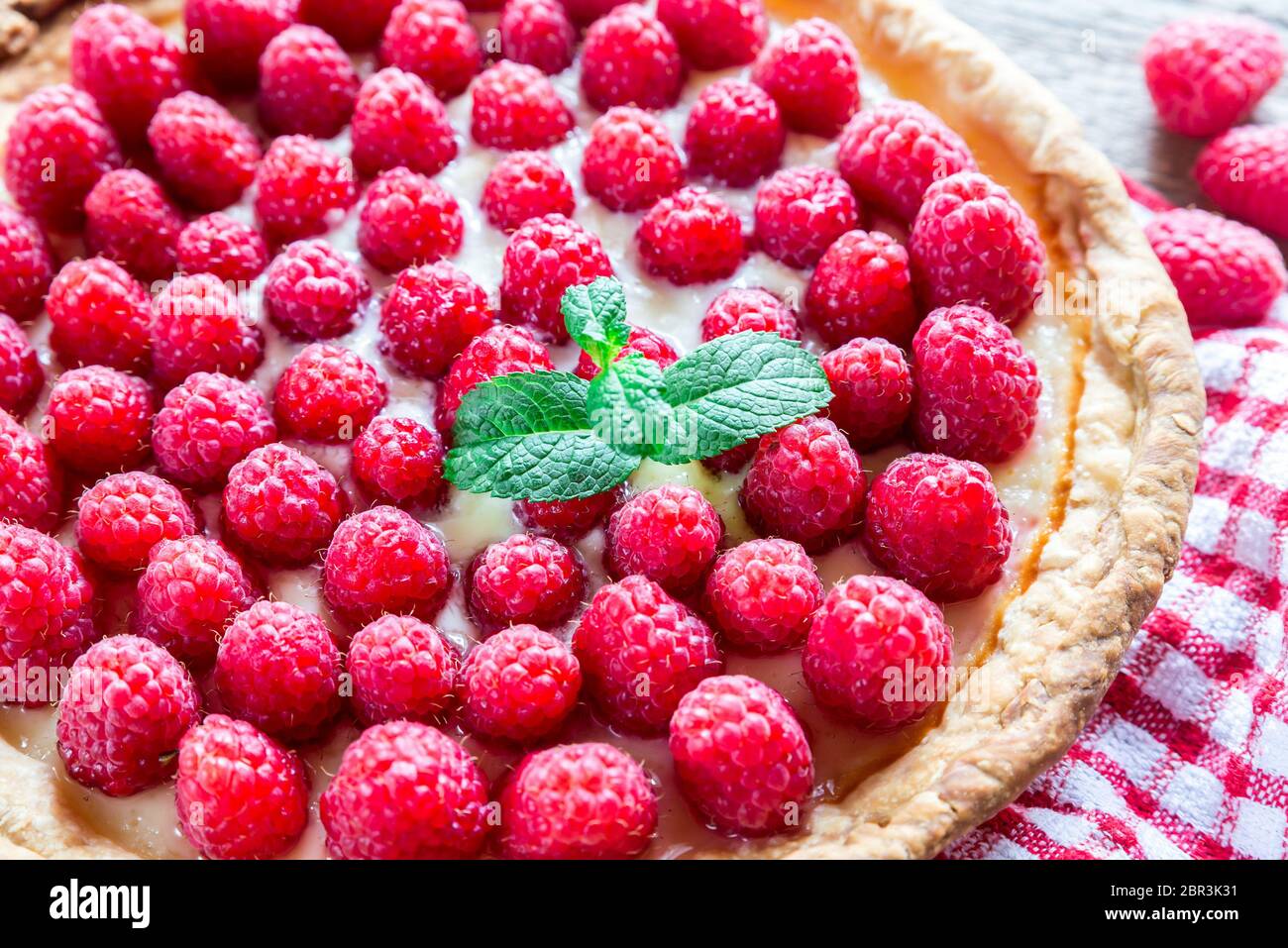 Raspberry tart with custard Stock Photo - Alamy