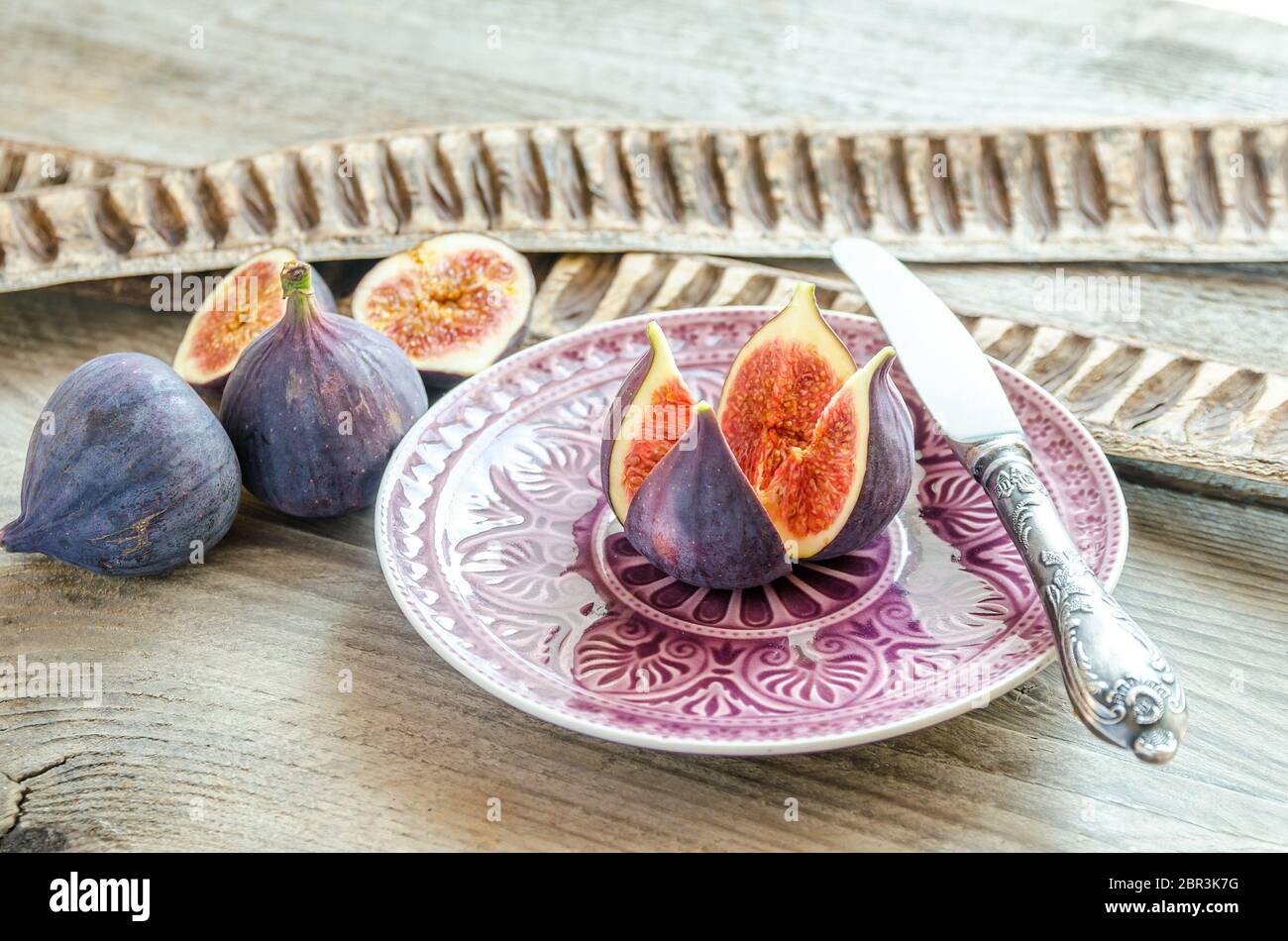 Honey pouring into cut fig Stock Photo - Alamy