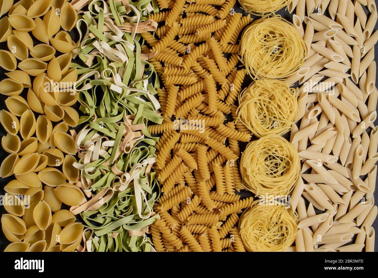 Variety of types and shapes of dry Italian pasta. Italian Macaroni raw ...
