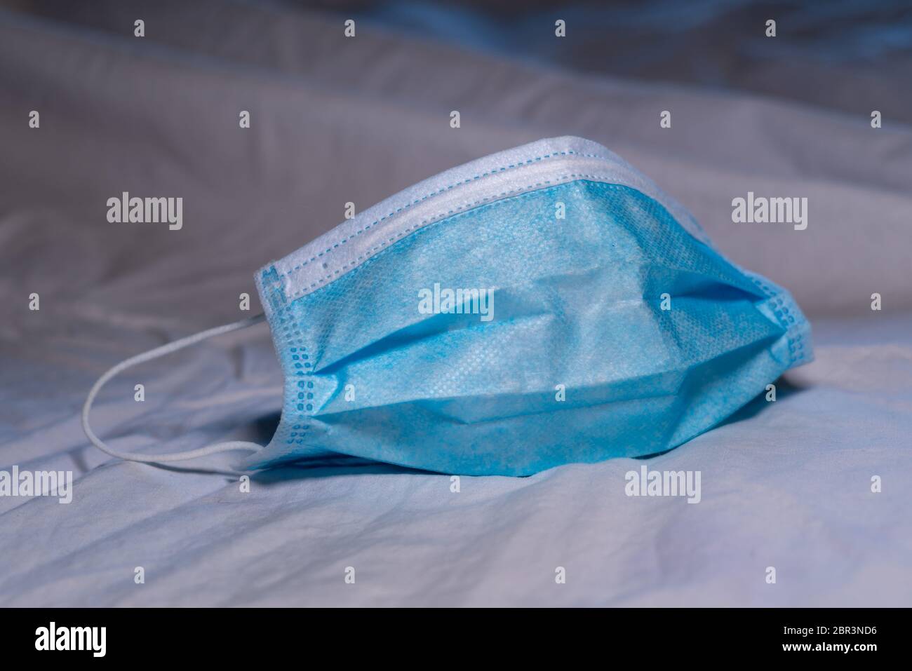 Blue face mask against viruses and other polluting pathogens in the air ...