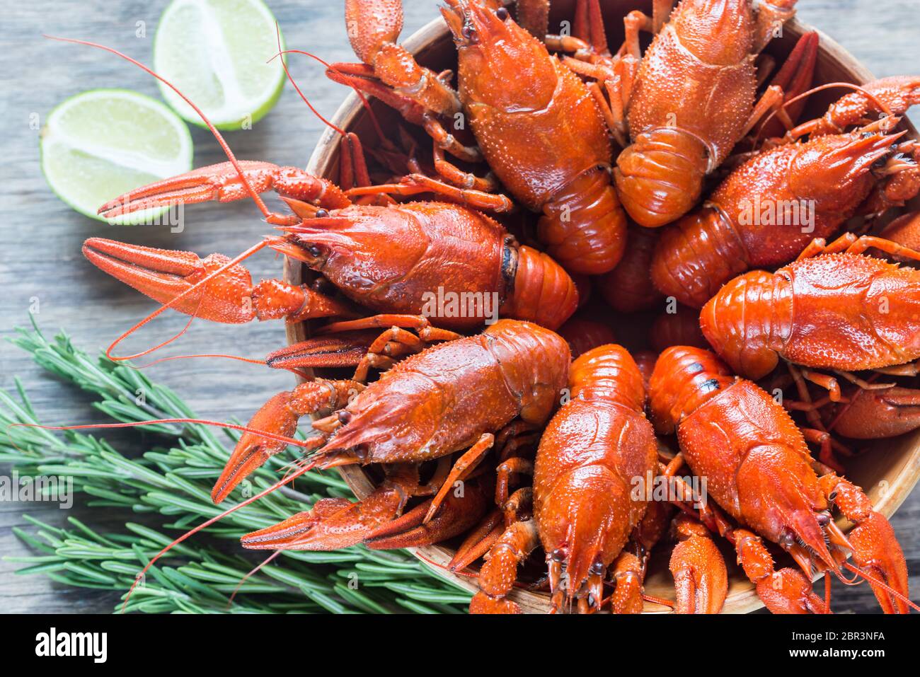 Bowl of boiled crayfish on the wooden table Stock Photo - Alamy