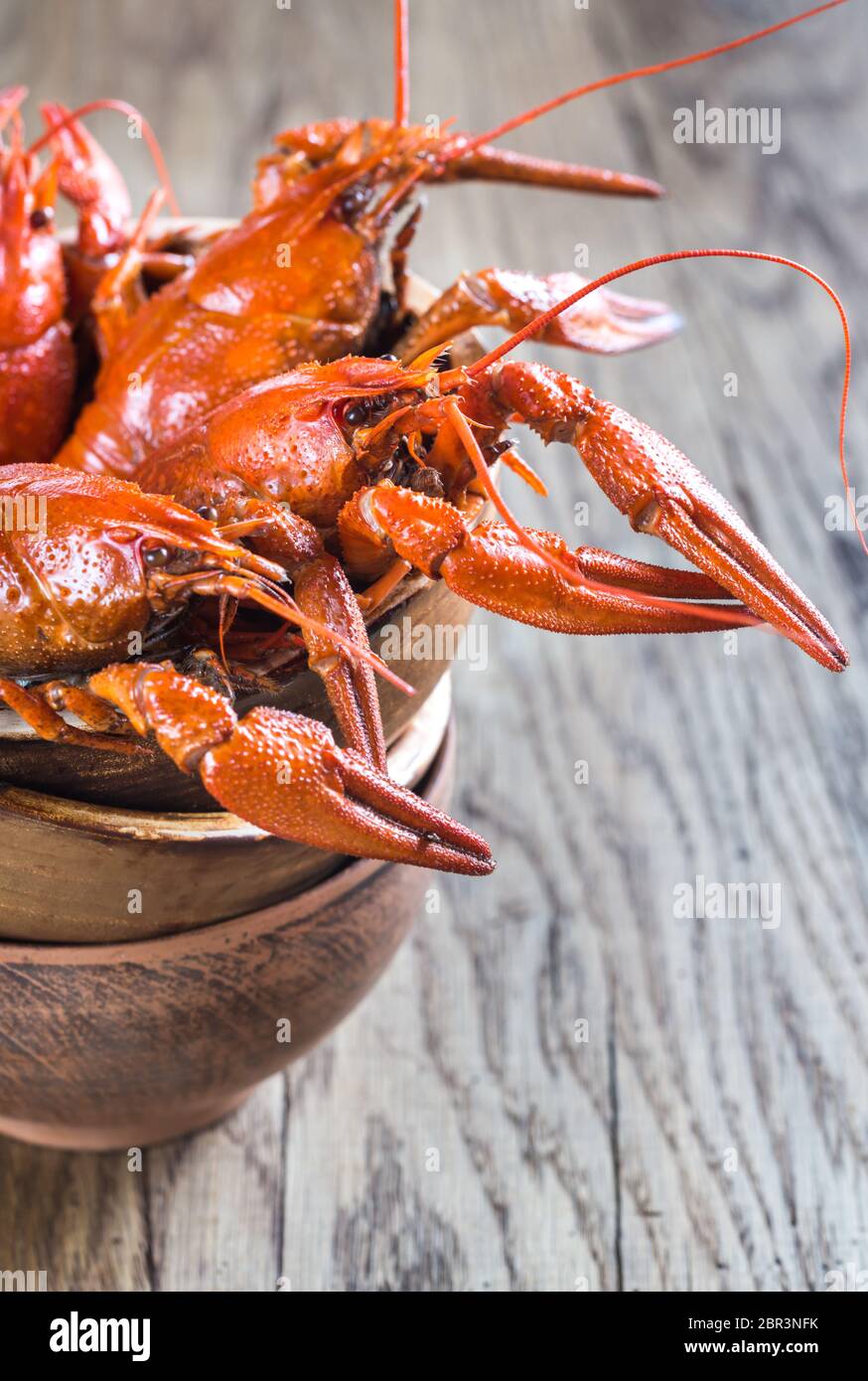 Bowl of boiled crayfish on the wooden table Stock Photo - Alamy