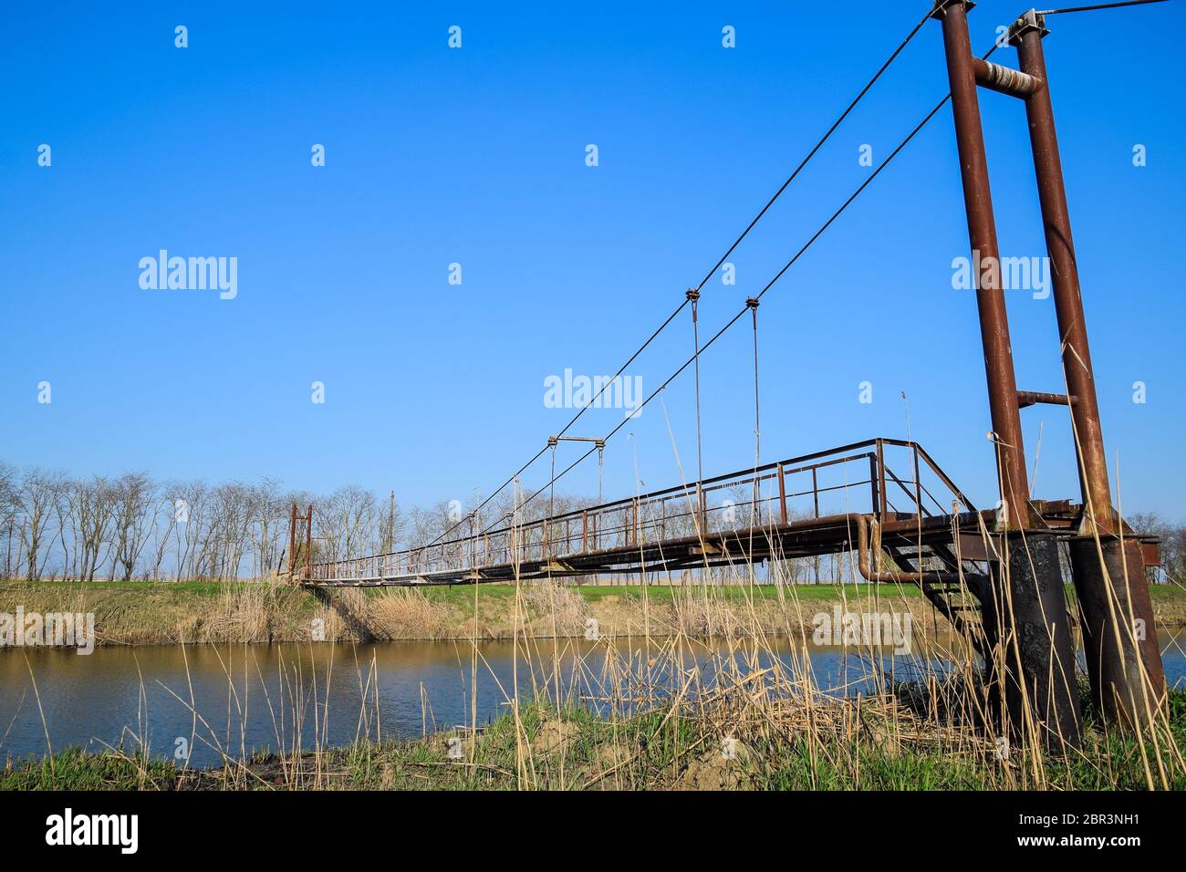Steel bridge and gas pipeline through the irrigation canal Stock Photo ...