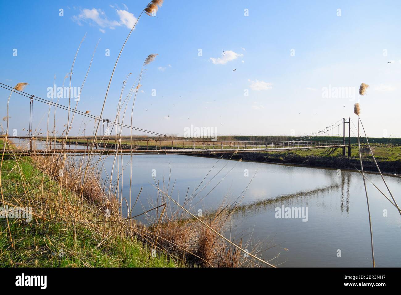 Steel bridge and gas pipeline through the irrigation canal Stock Photo ...
