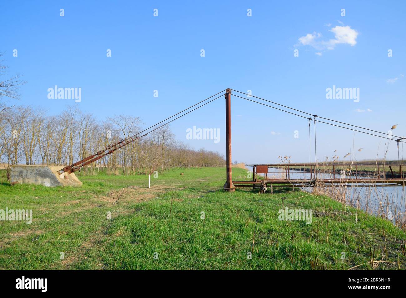 Steel bridge and gas pipeline through the irrigation canal Stock Photo ...