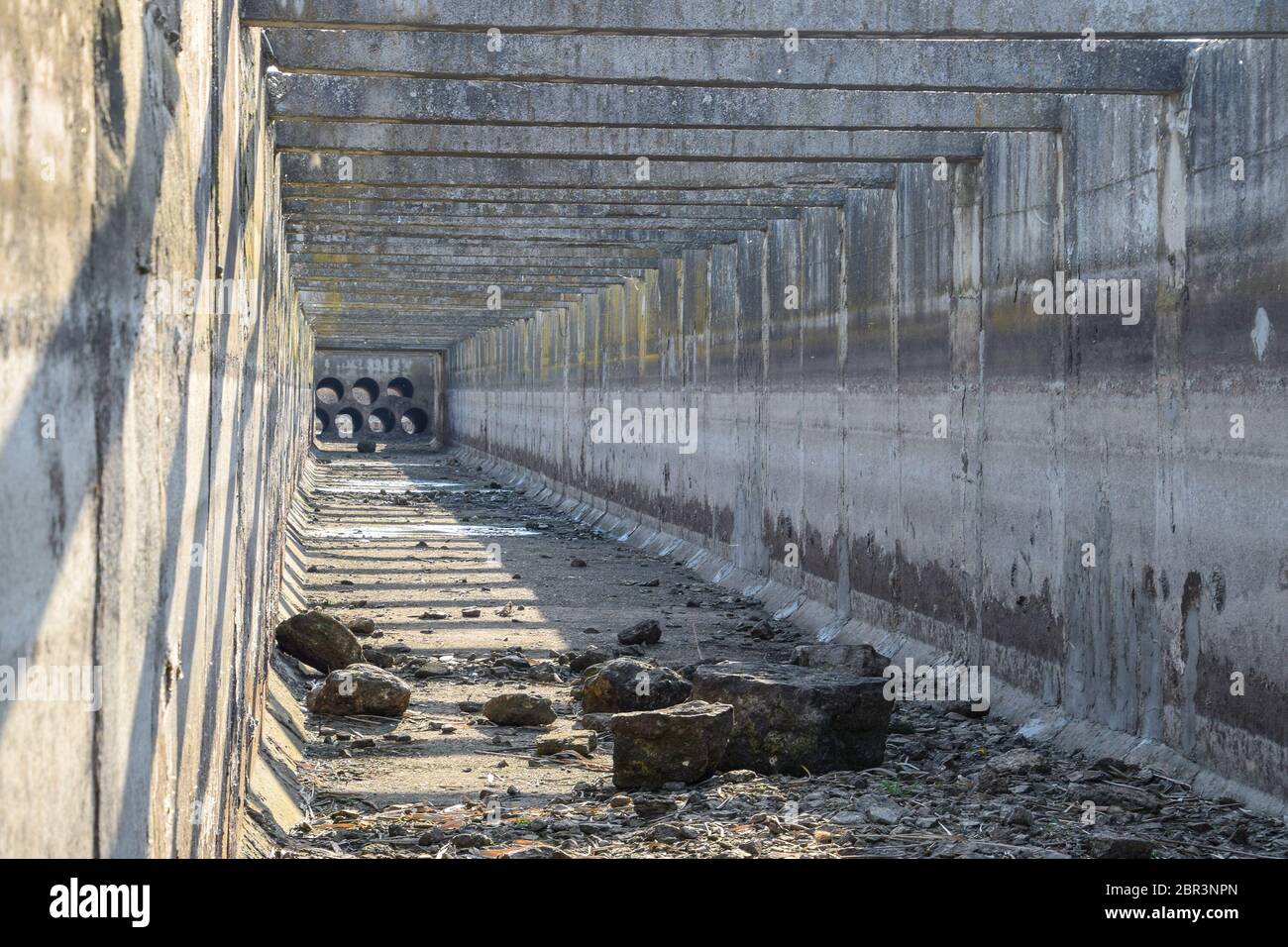 Canal irrigation system rice fields. Concrete tunnel for the irrigation ...