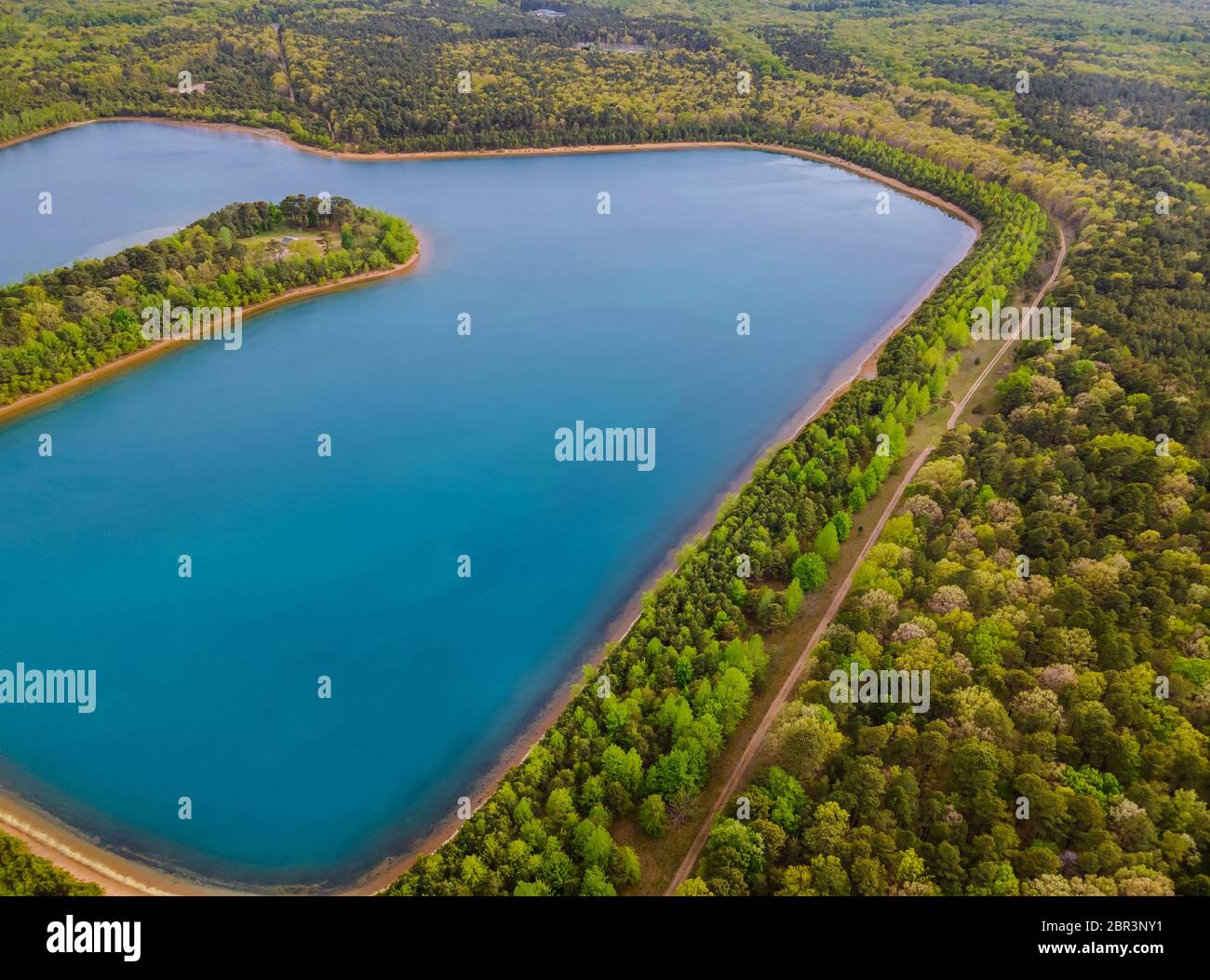 Landscape panorama, blue water in a forest lake with green forests ...