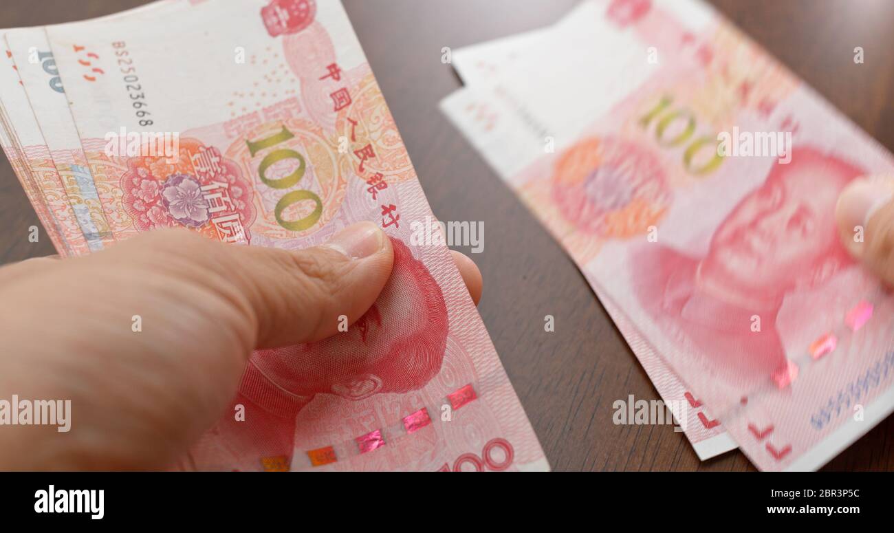 Counting Chinese RMB banknote Stock Photo - Alamy