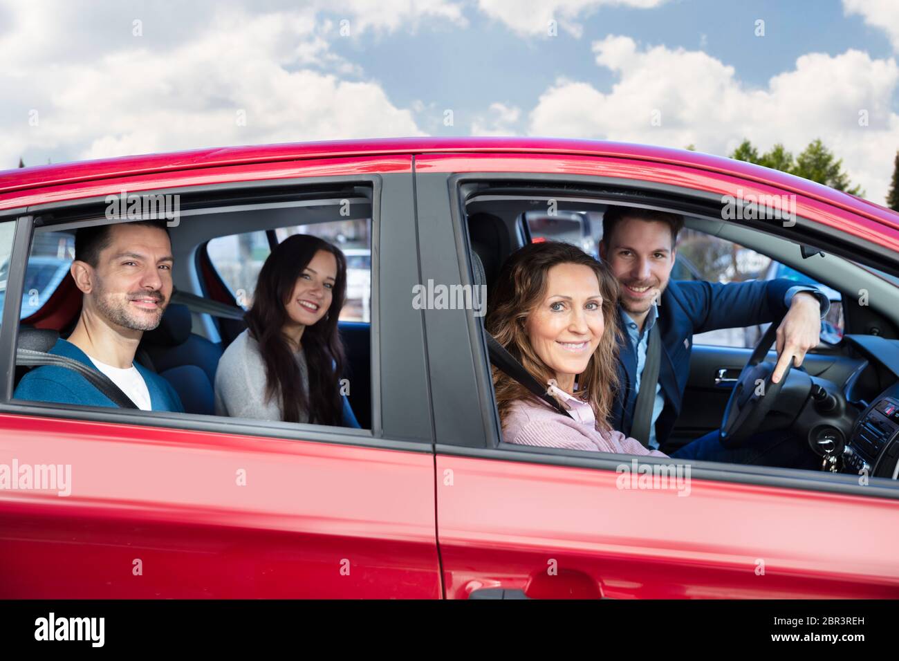 Group Of Happy Friends Having Fun In The Car Stock Photo - Alamy