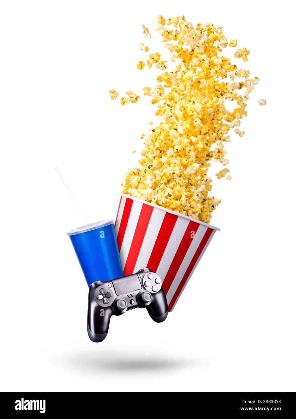 Paper bucket with popcorn, cup of drink and video game joystick on ...