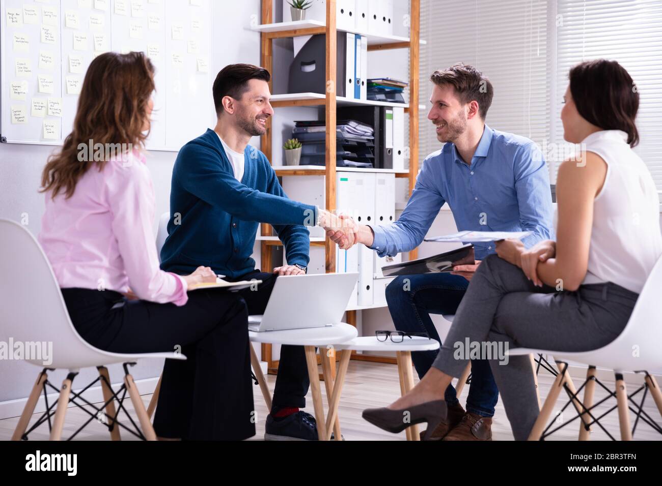 Male And Female Businesspeople Handshake In Office Stock Photo - Alamy