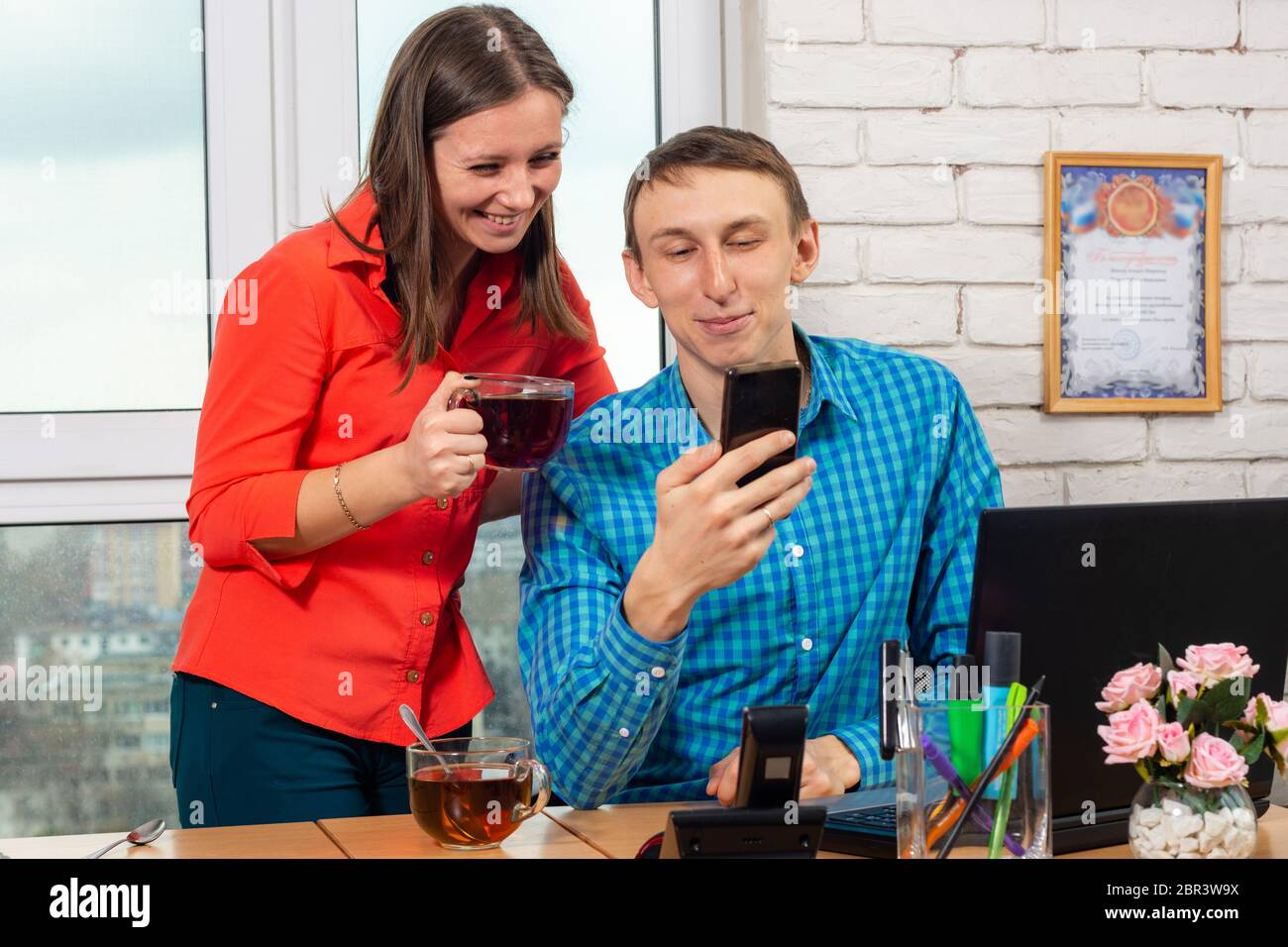 Office staff drinking tea at work Stock Photo - Alamy