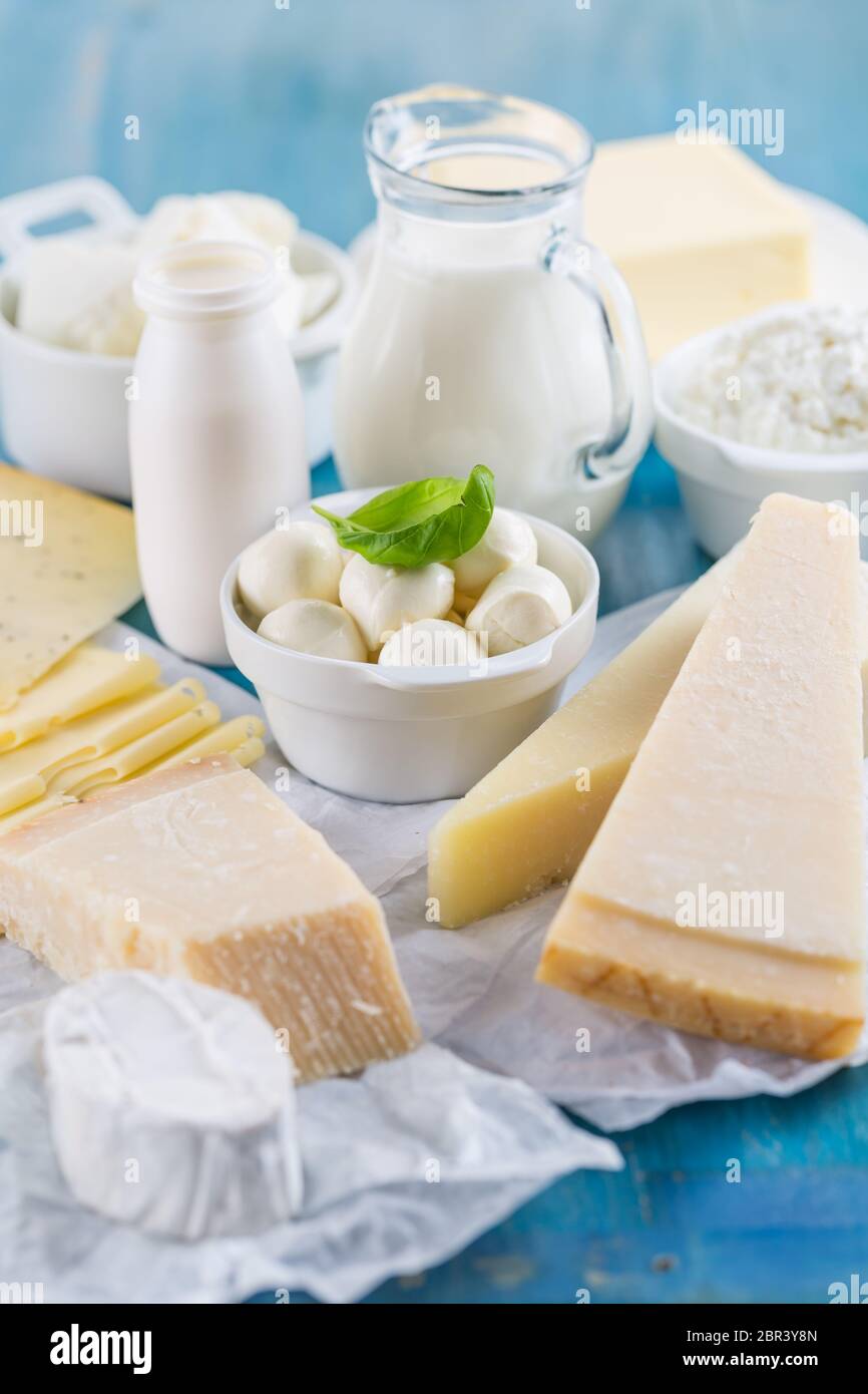 Different types of dairy products on wooden background Stock Photo - Alamy