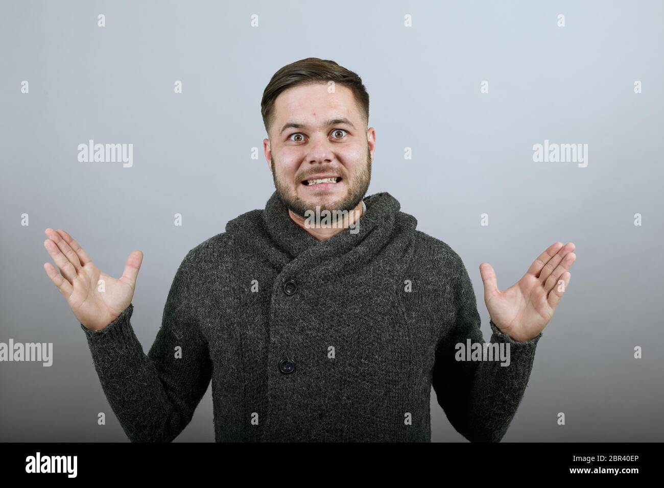 Man looking confused hands up hi-res stock photography and images - Alamy