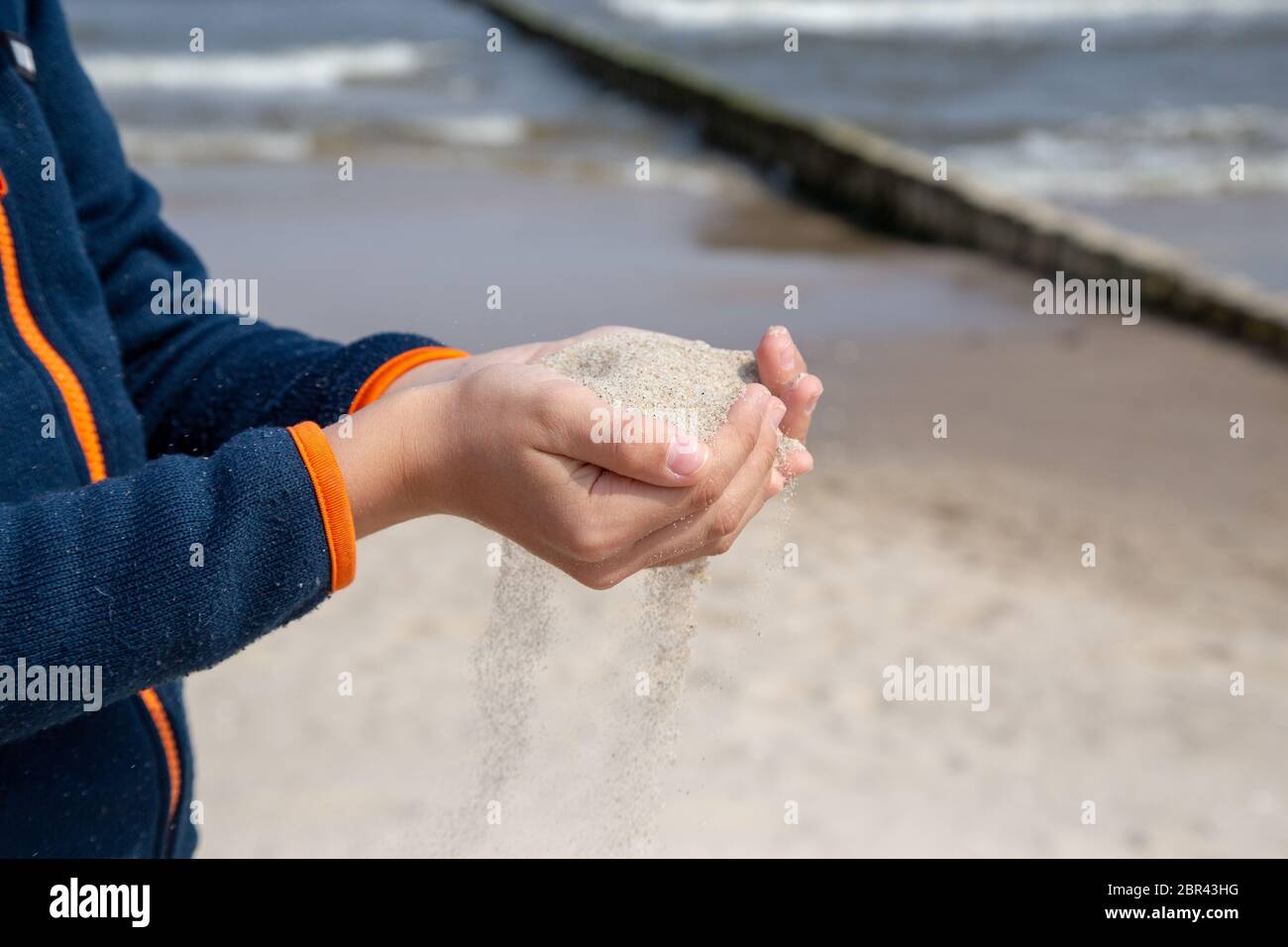 Sand Falling Through Hands High Resolution Stock Photography and Images ...