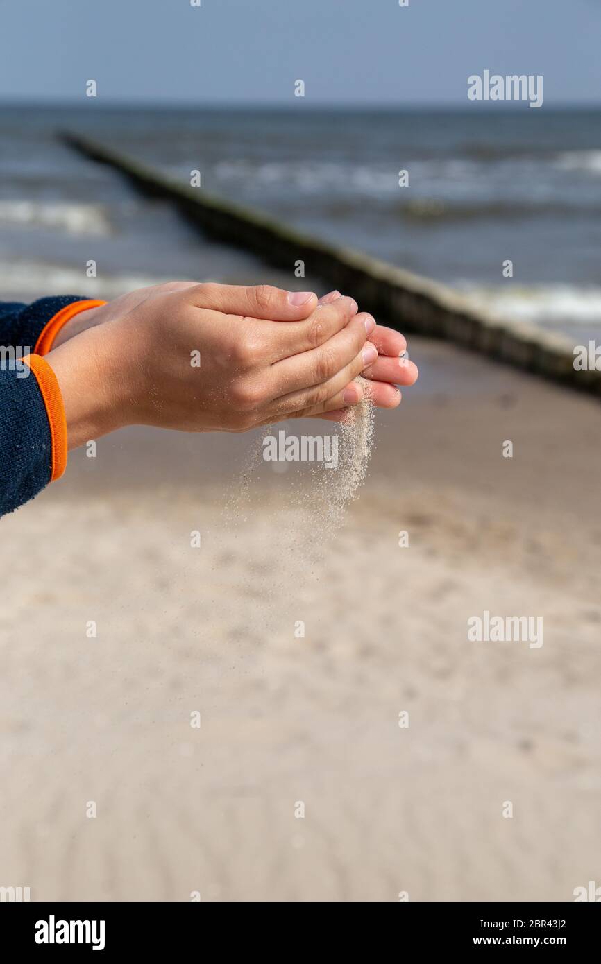 Sand Falling Through Hands High Resolution Stock Photography and Images ...