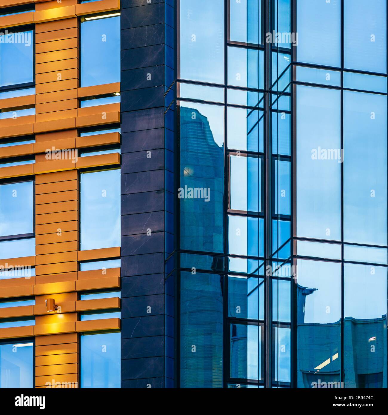 Modern high-rise office building with a glass facade, background Stock ...