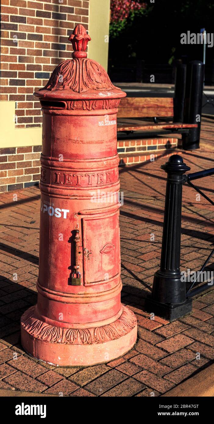 View of an old traditional red mail box on a street in Armidale, NSW ...