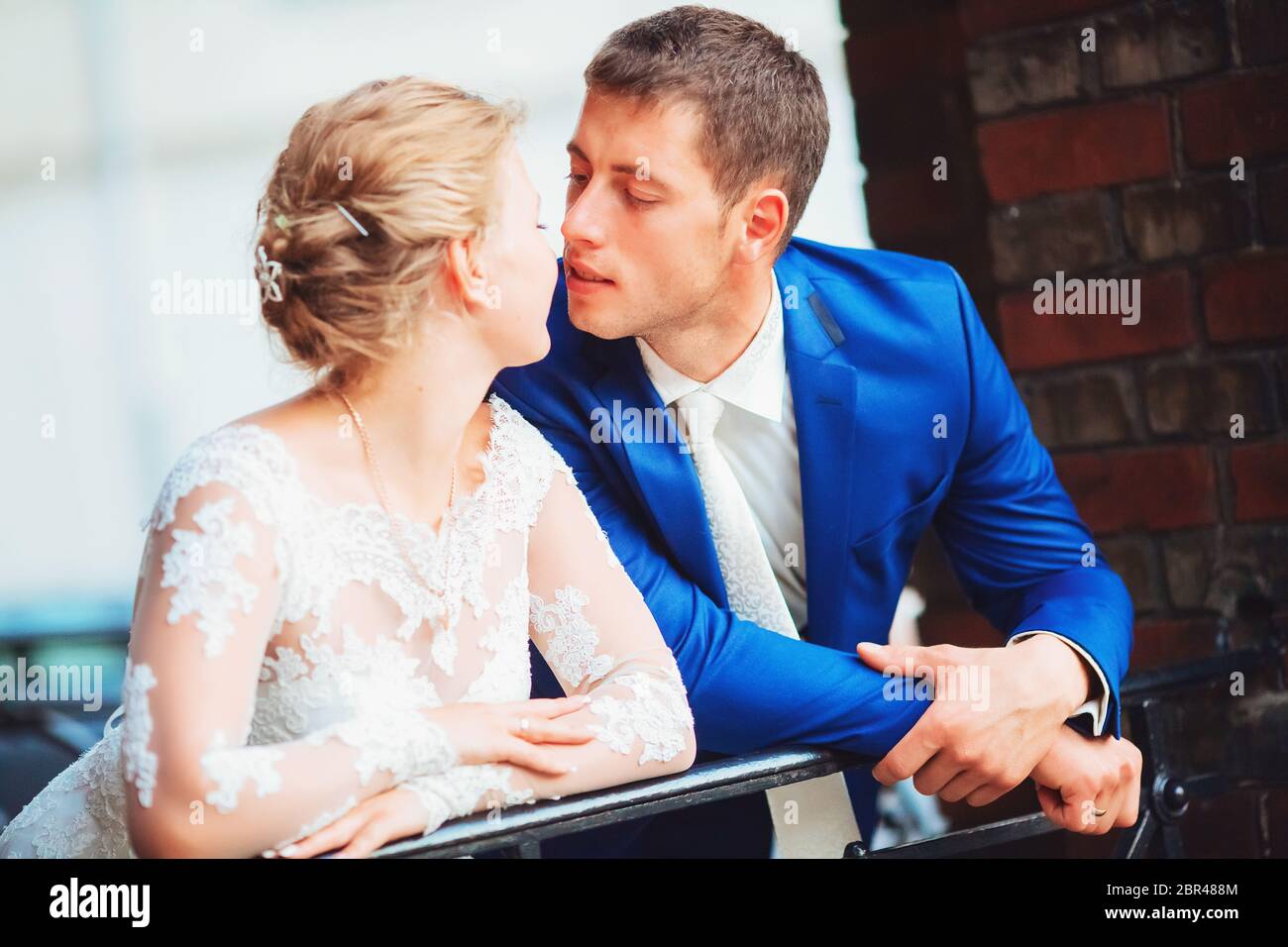 bride and groom walk around the old town Stock Photo - Alamy