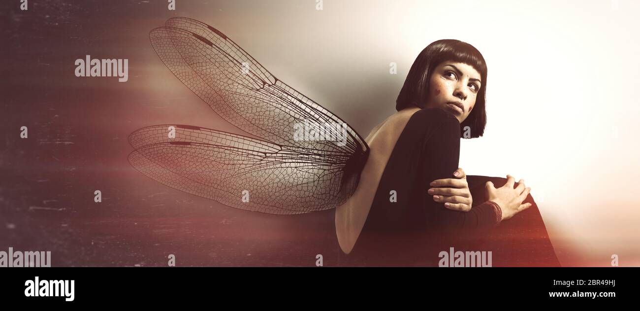 Delicate, feminine fragility. Young woman with wings. Conceptual and ...