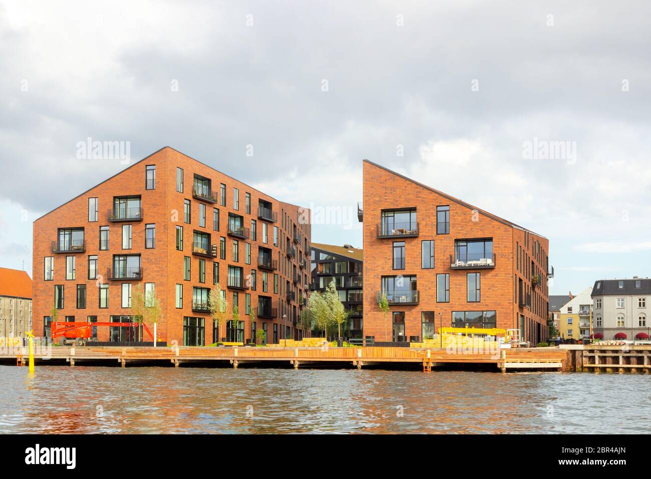 Modern brick buildings houses along the canal in Copenhagen, Denmark ...