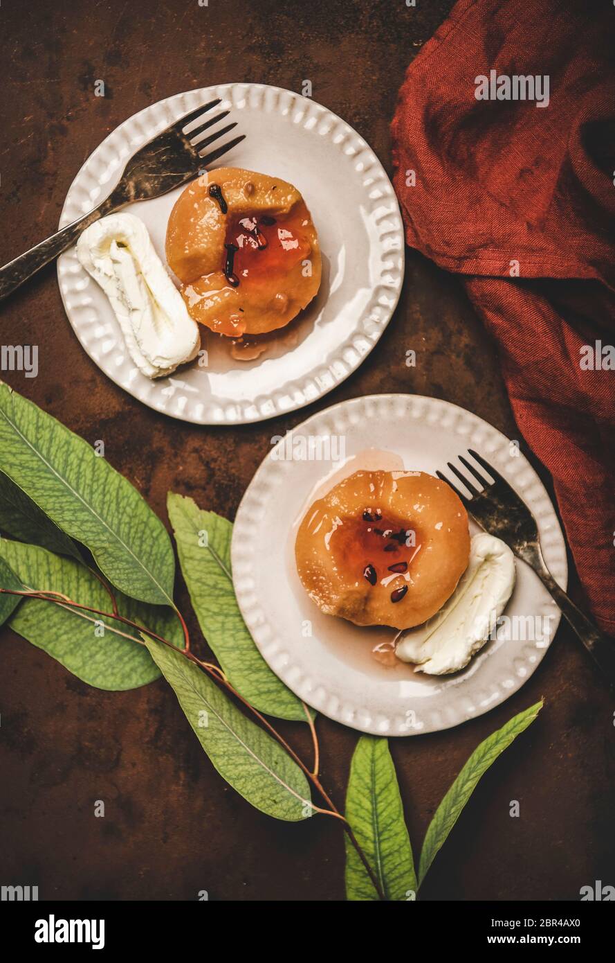 Flat-lay of Turkish traditional dessert with sweet quince boiled in ...