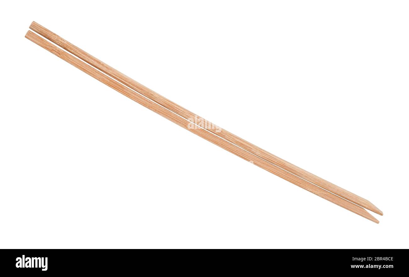 disposable brown wooden chopsticks put together isolated on white ...