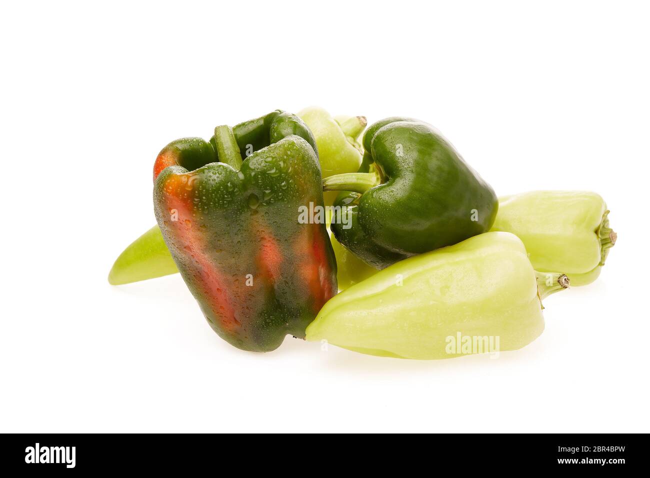 Fresh ripe peppers on white background Stock Photo - Alamy