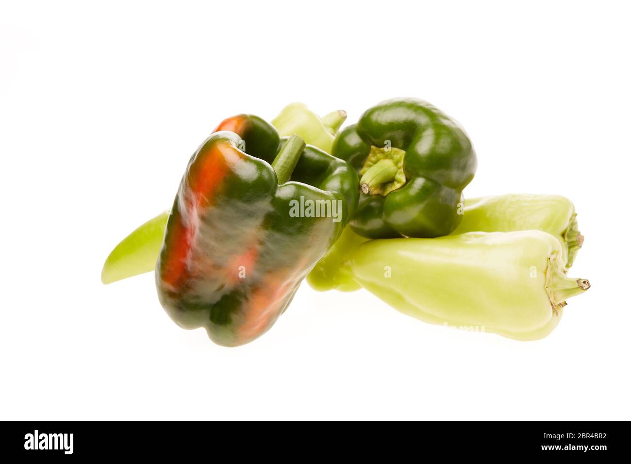 Fresh ripe peppers on white background Stock Photo - Alamy