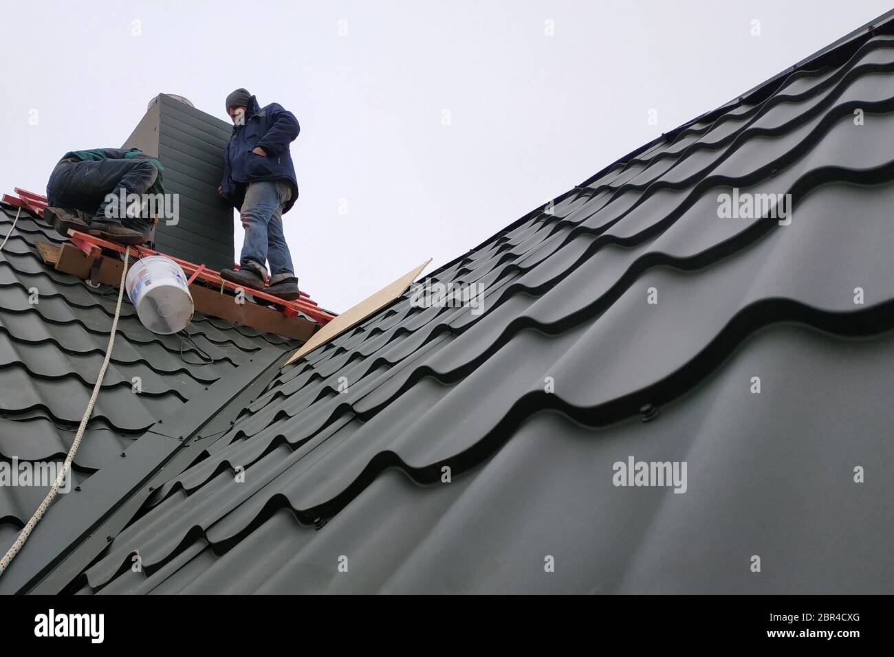 Working with roofing material, metal roof, hand tools screwdriver.2020 ...