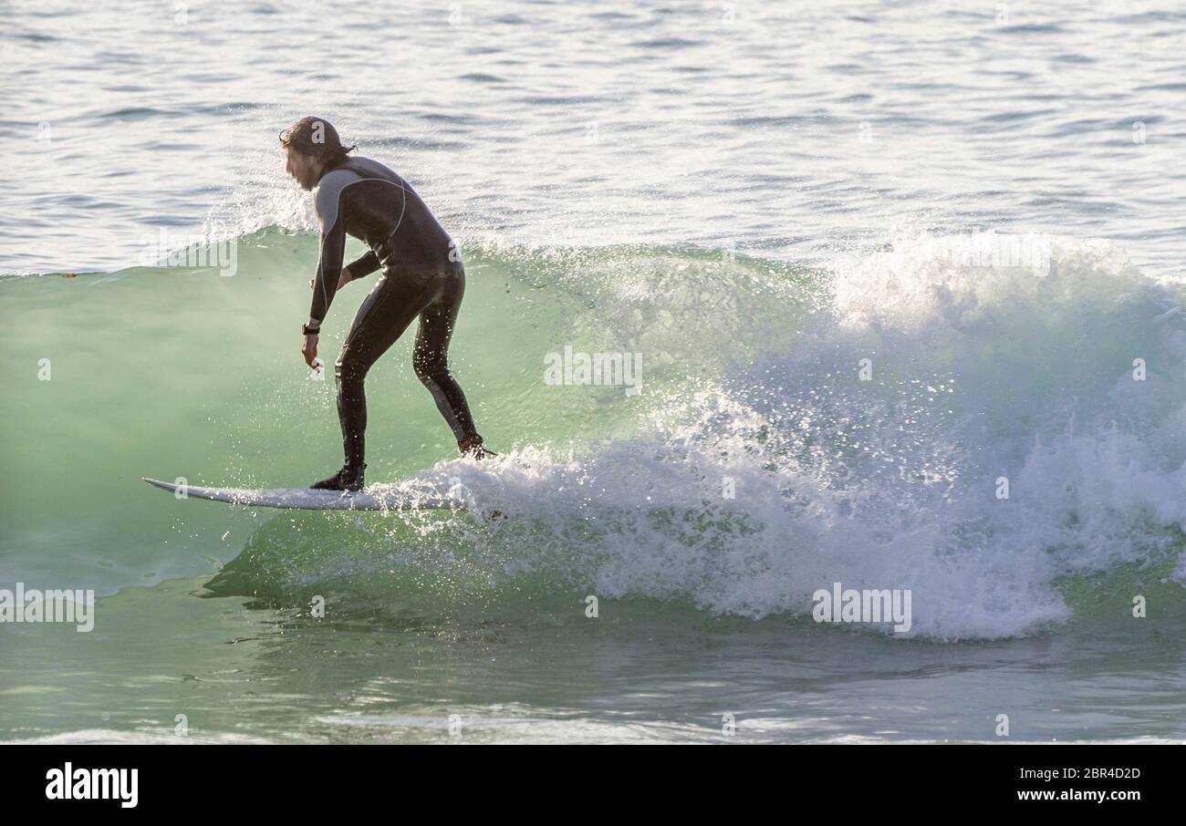 Surfer riding the waves of the sea Stock Photo - Alamy