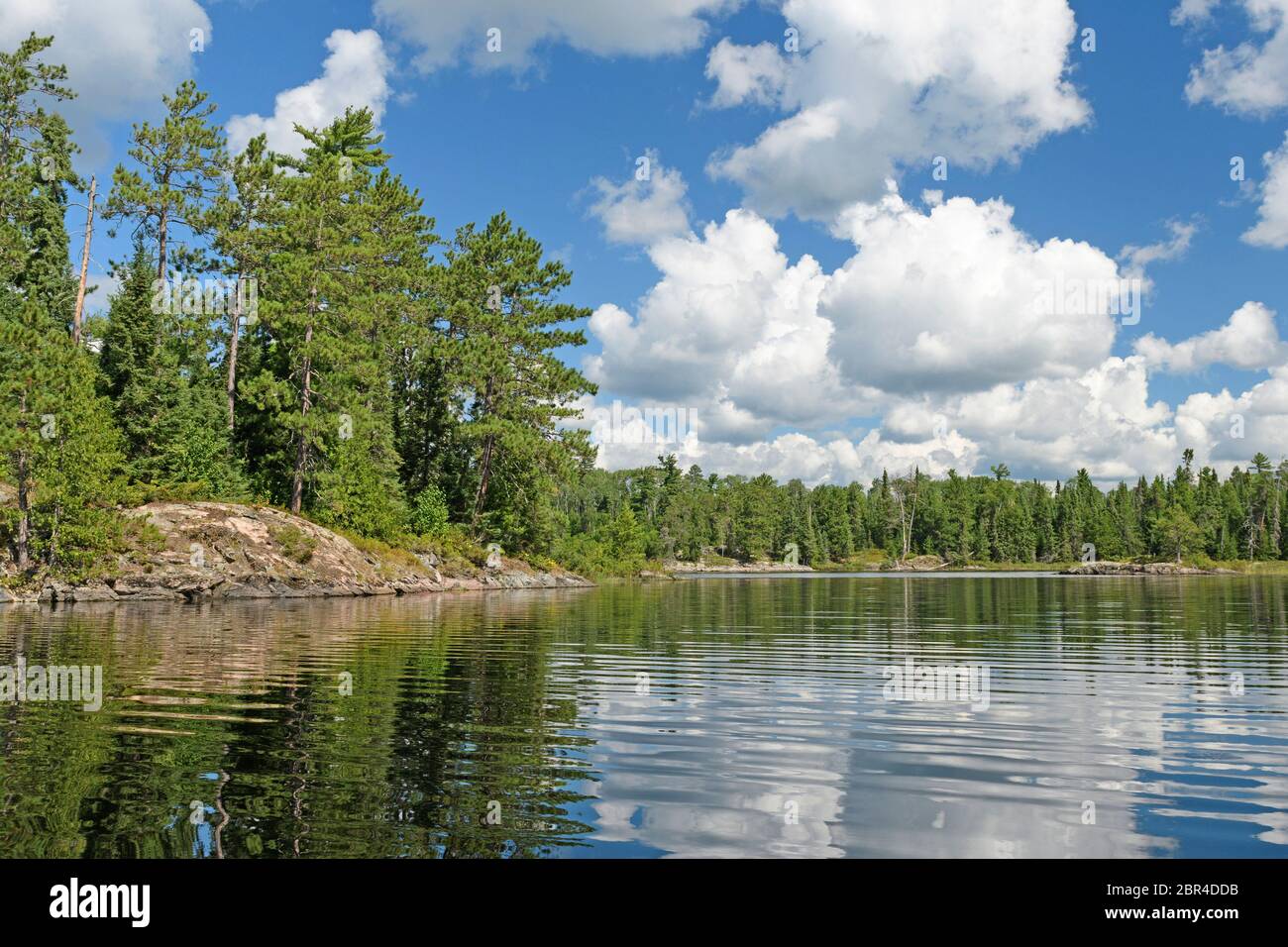 Puffy Summer Afternoon Clouds over the North Woods on Saganagons Lake ...