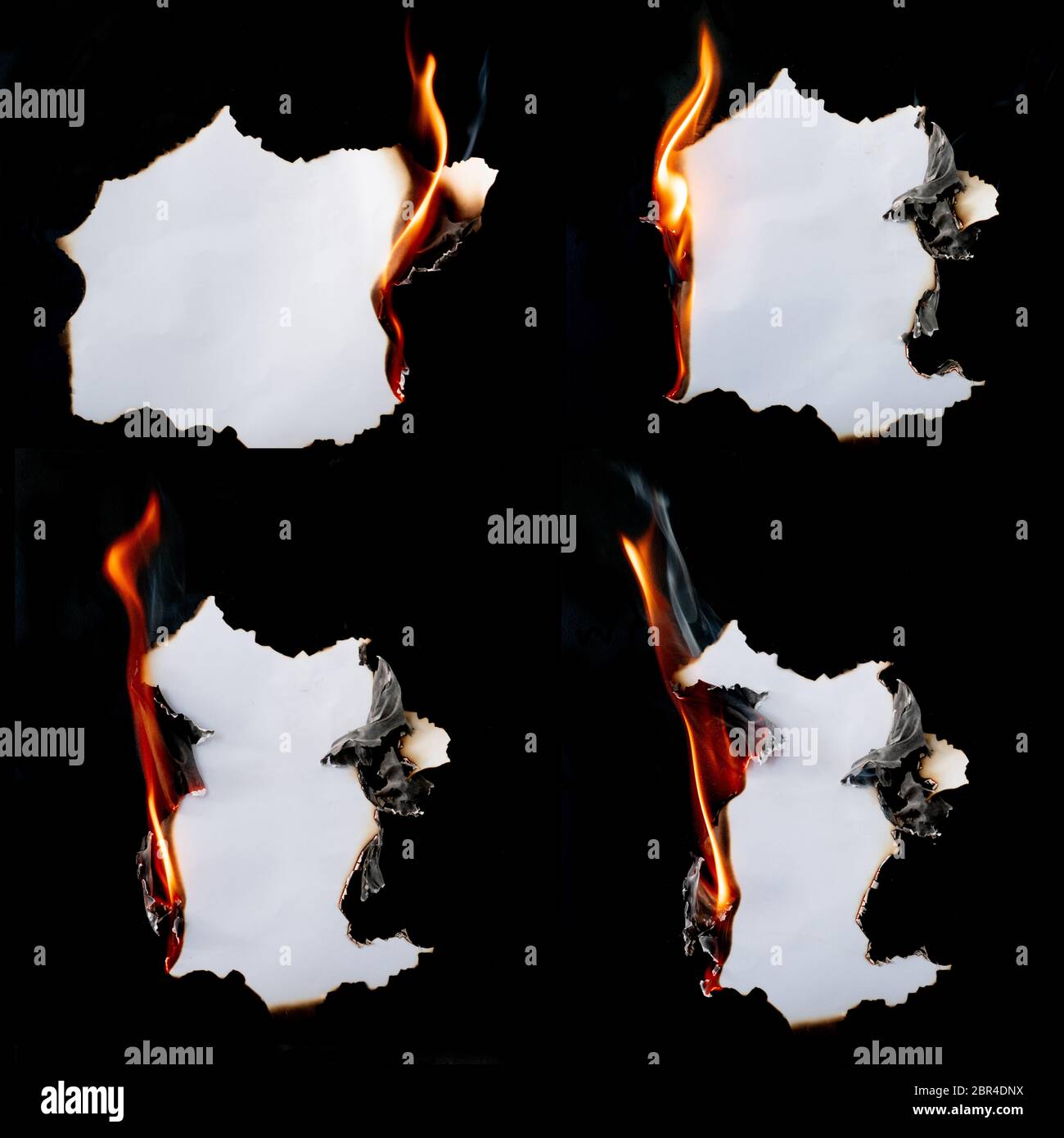 burning piece of paper on black background Stock Photo - Alamy